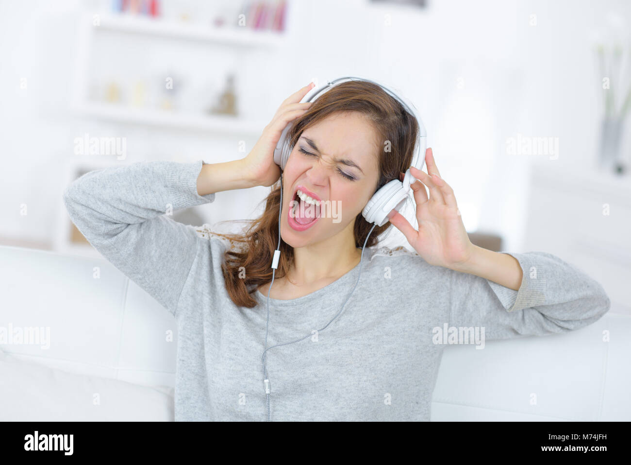 urban woman singing rock at home Stock Photo - Alamy