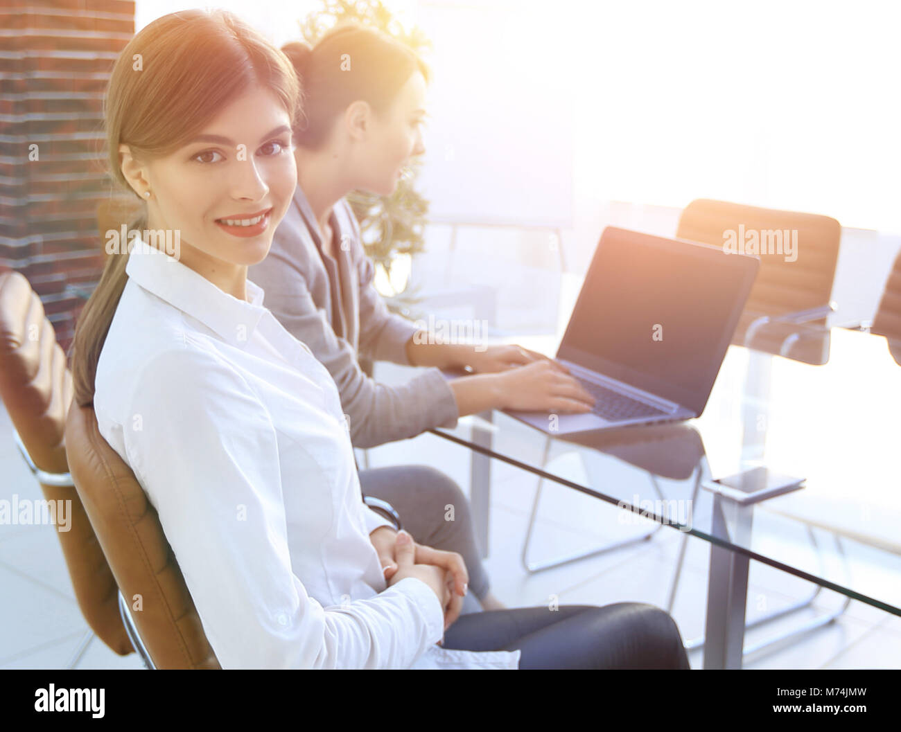 office workers sitting behind a Desk Stock Photo - Alamy