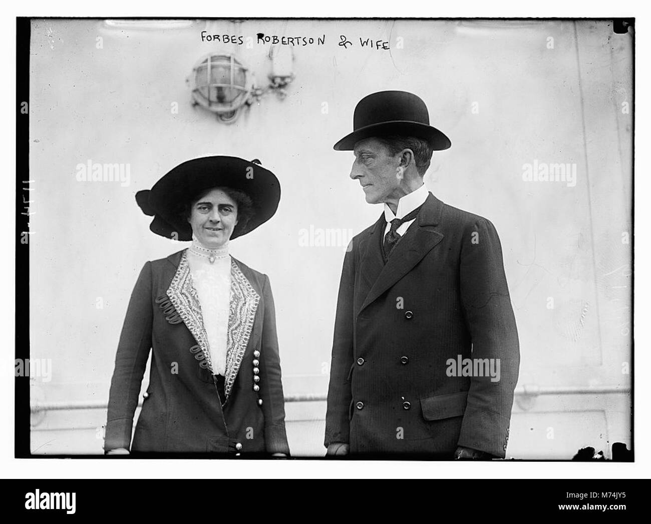 This photograph shows Forbes Robertson with his wife, offering a ...