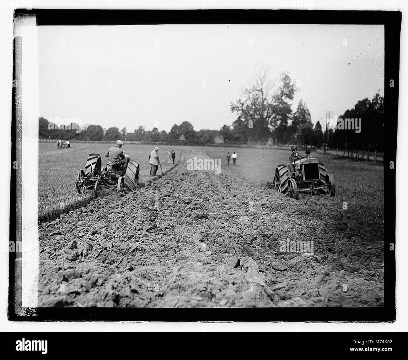 This image depicts a Ford tractor demonstration, showcasing the ...