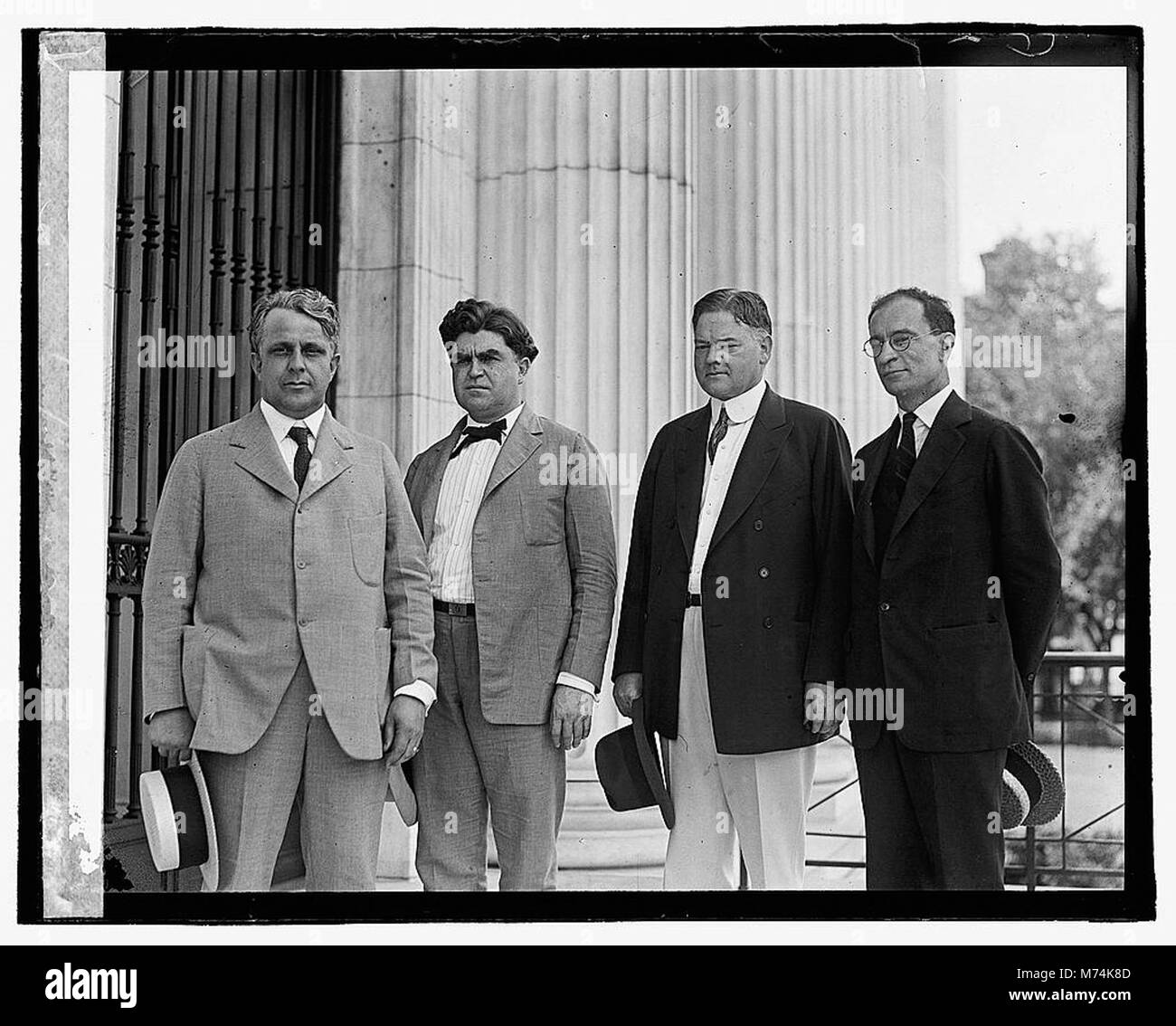 This photograph captures four men standing outside a building on July 2 ...