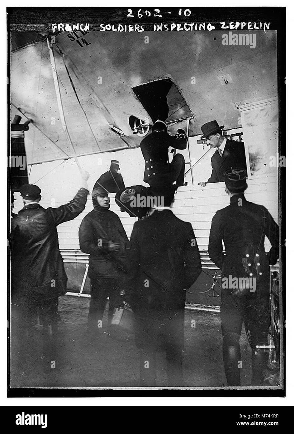 French soldiers inspecting a Zeppelin, a notable event during World War ...