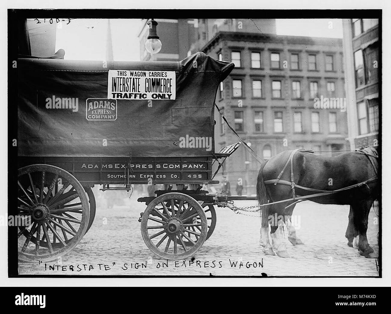 A vintage image of an 'Interstate' sign displayed on an express wagon ...