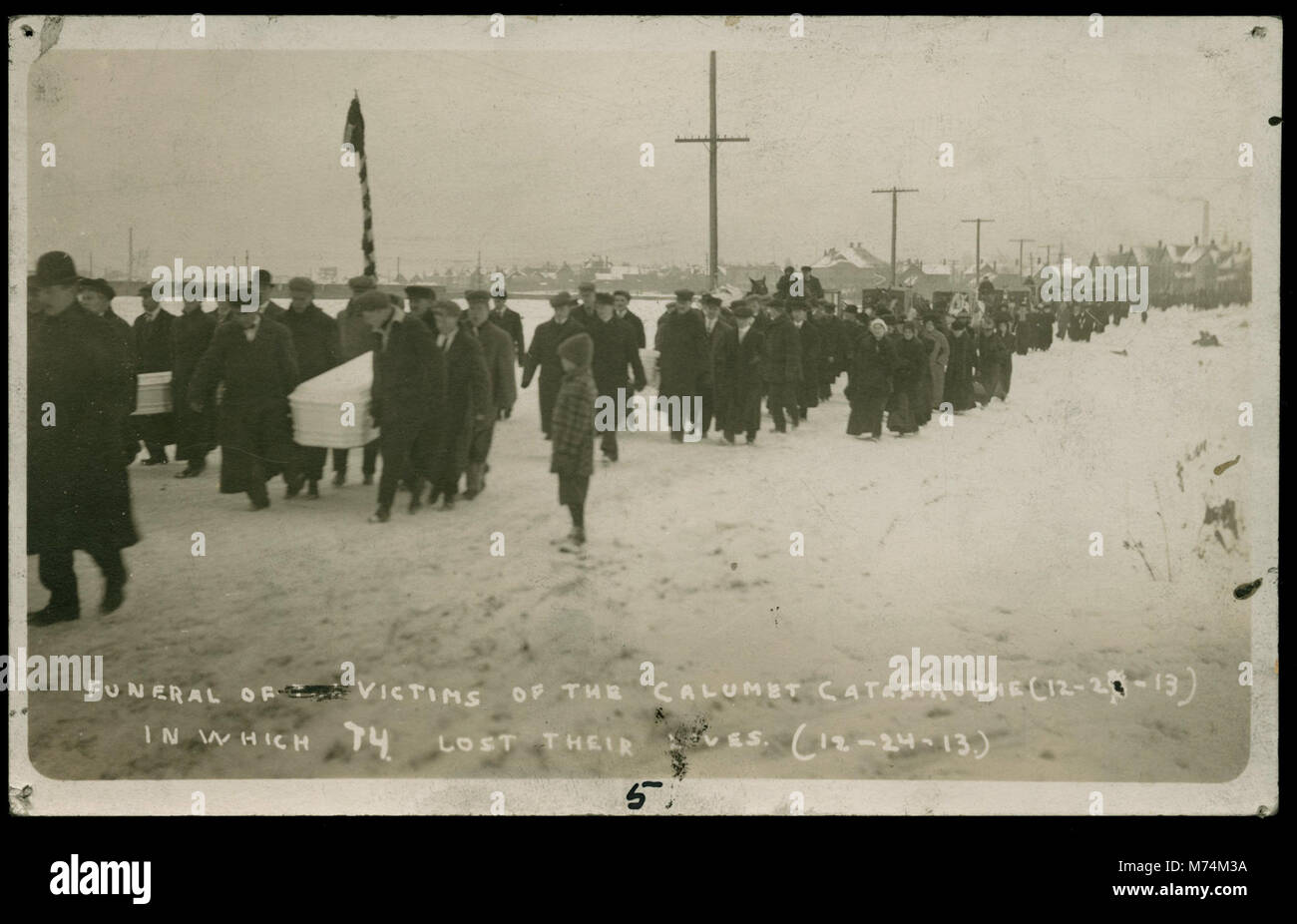 A somber photograph from the funeral of the victims of the Italian Hall ...