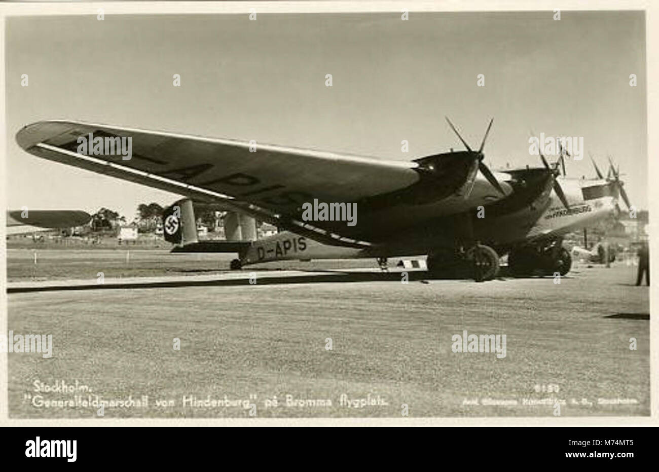 The image depicts an aircraft at Bromma Airport featuring a Nazi symbol ...