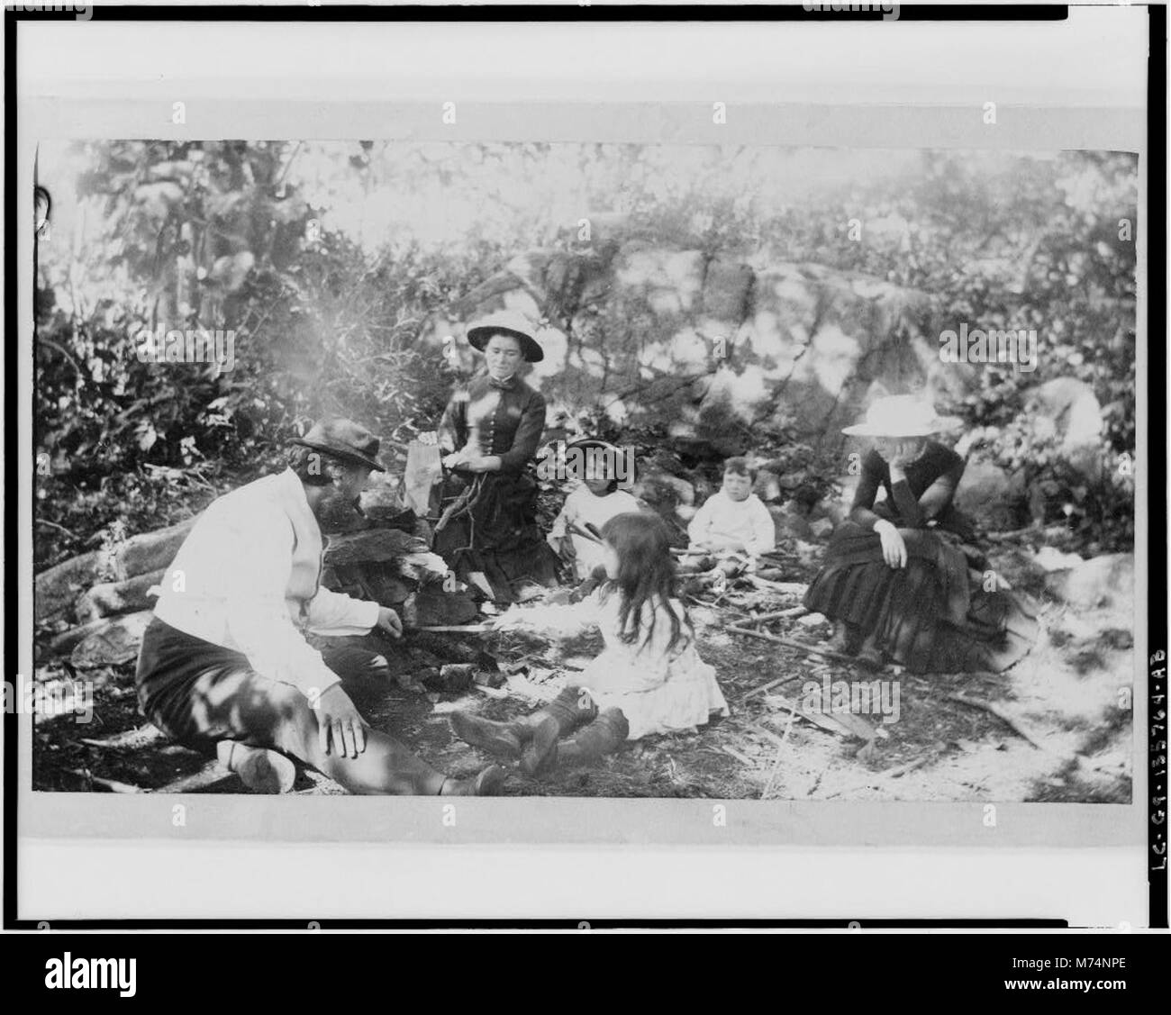 A photograph of Alexander Graham Bell and his family, with a nurse ...
