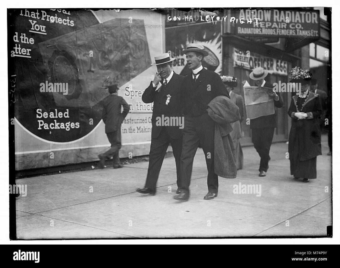 Governor Hadley, shown on the right in this historical photograph ...
