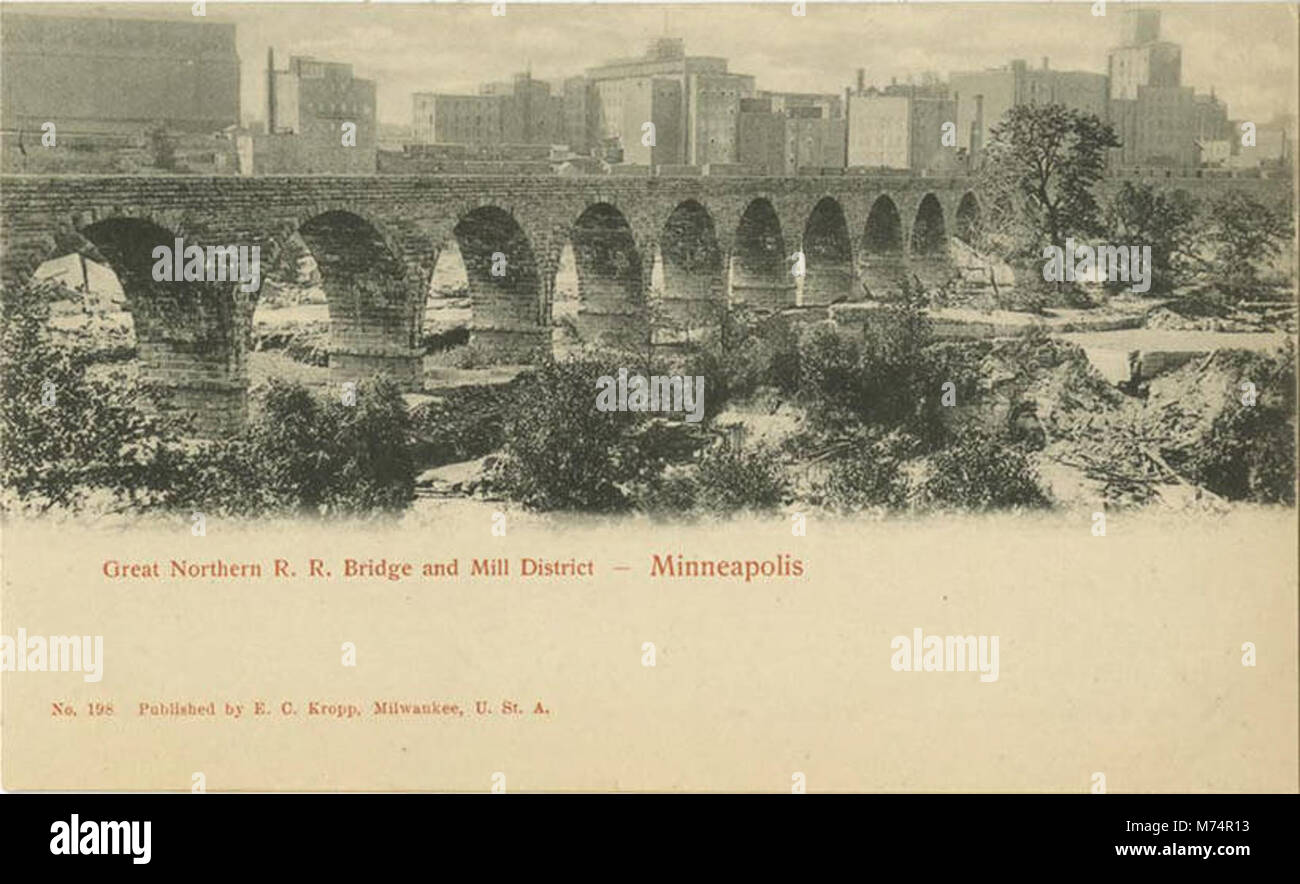 The image shows the Great Northern Railroad bridge and the mill ...