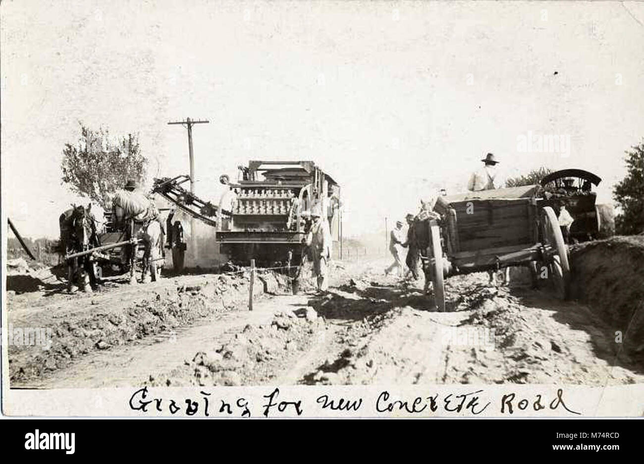 This image shows workers grooving a newly laid concrete road, a key ...
