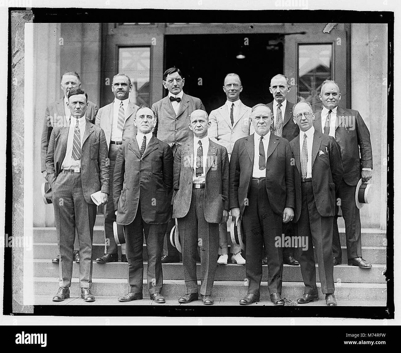 Group people stands on Black and White Stock Photos & Images - Alamy