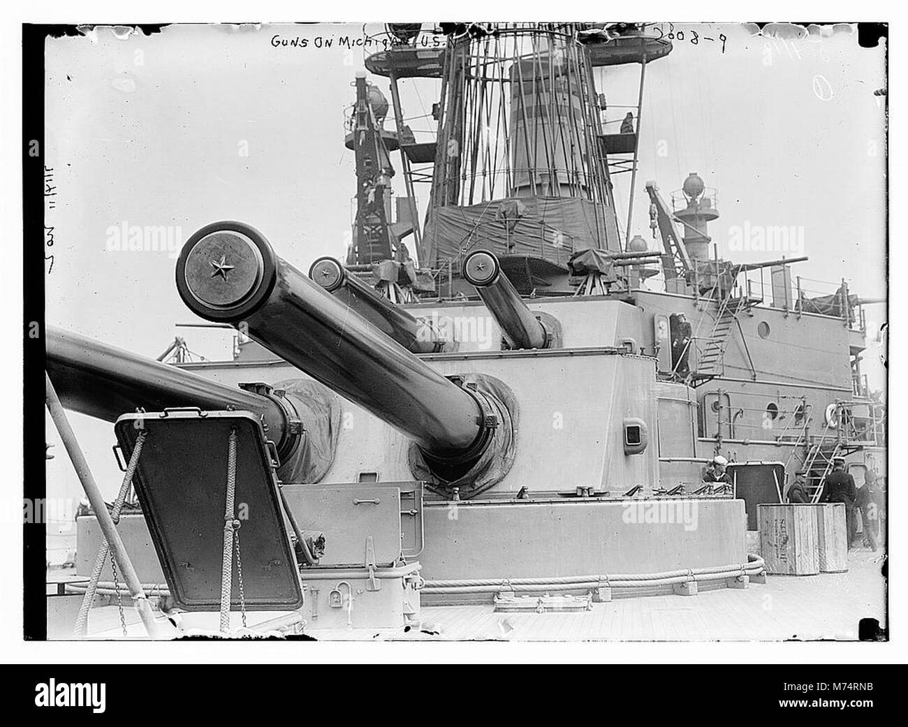 A photograph of naval guns mounted on a U.S. Navy ship, identified as ...