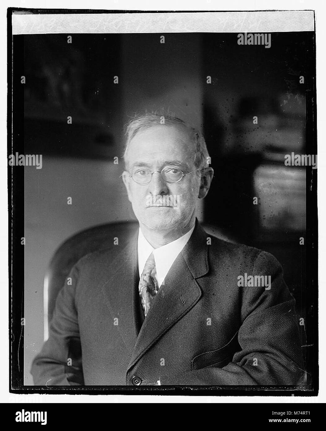 A formal portrait of H.H. McKee, captured in 1921, showcasing his role ...