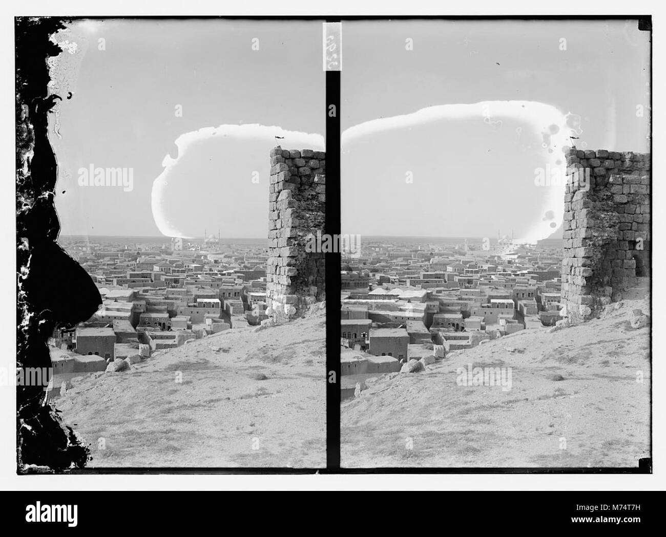 This photograph depicts Hama, a city in Syria, known for its historical ...