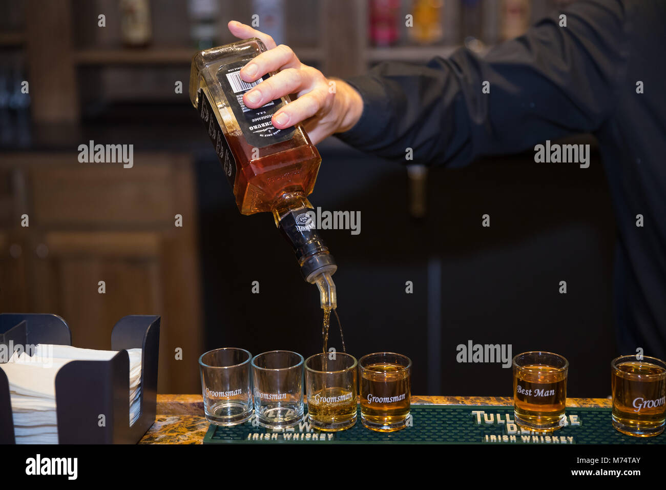 Bartender Pouring Shots for Bridal Party Stock Photo - Alamy