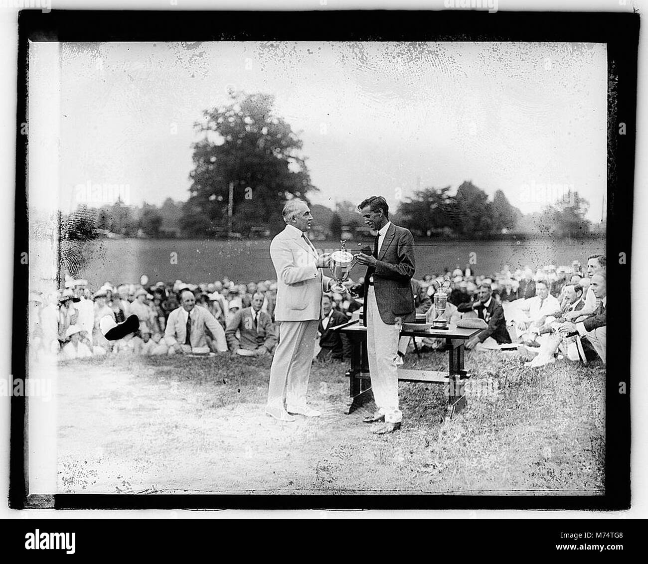 A photograph of President Warren G. Harding with golfer Jim Barnes on ...