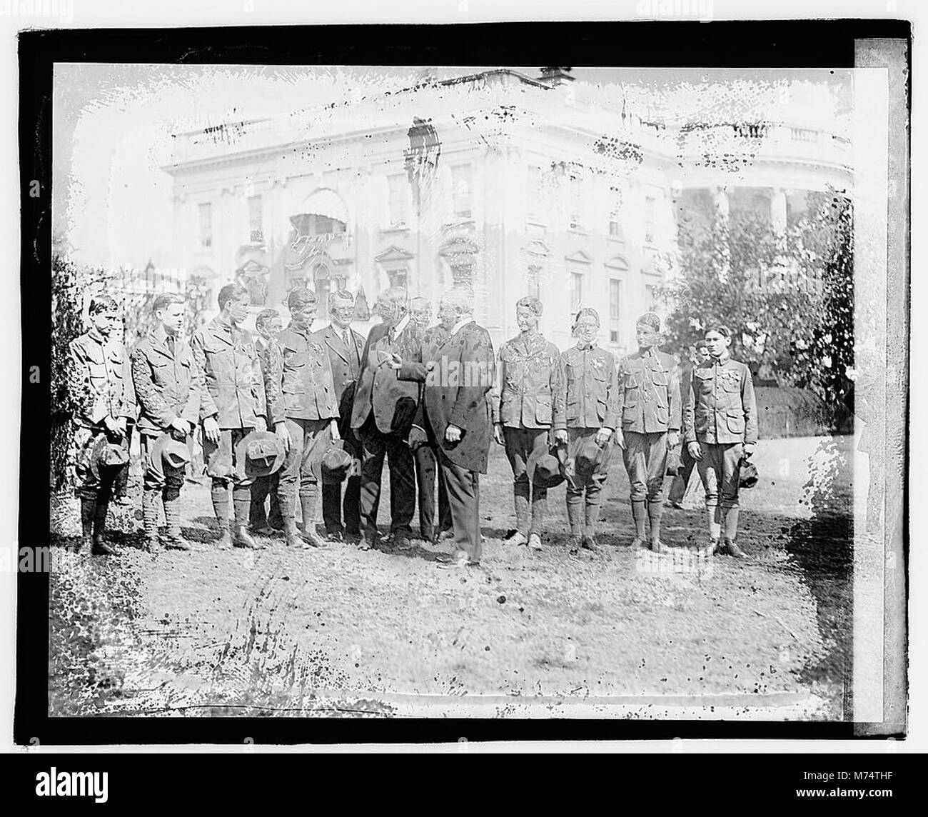 Photograph of President Harding with a group outside the White House on ...