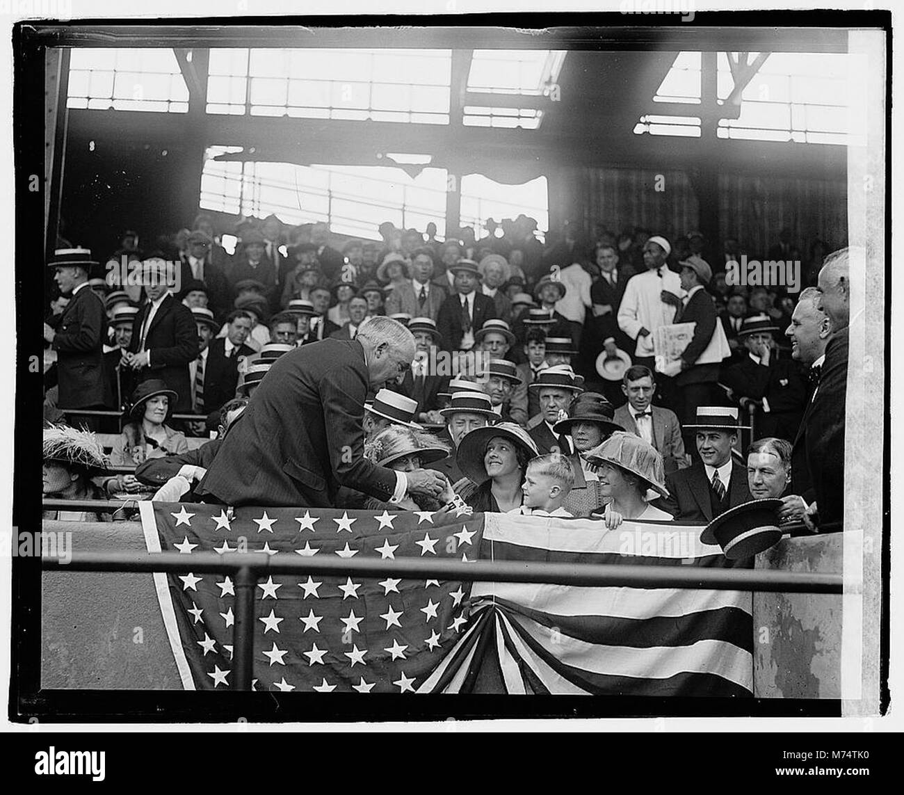 A photograph showing President Warren G. Harding attending a ball game ...