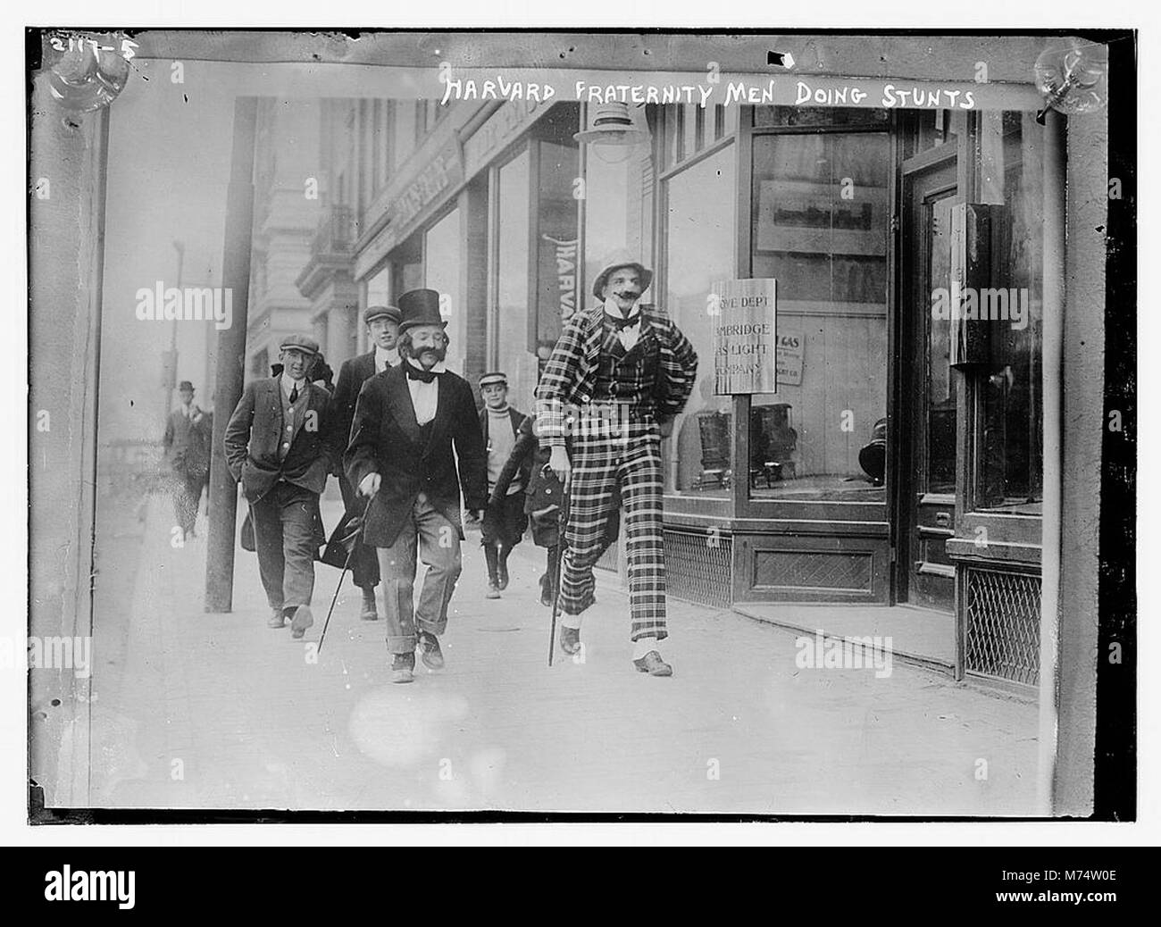 This photograph shows Harvard University fraternity men performing ...