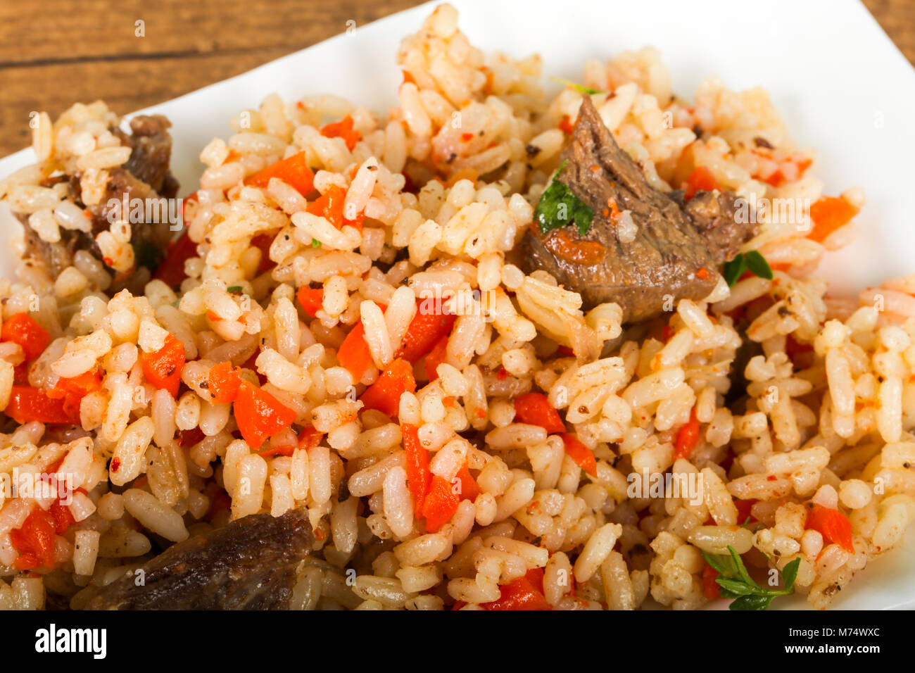 Asian rice - Plov with meat and carrot Stock Photo - Alamy