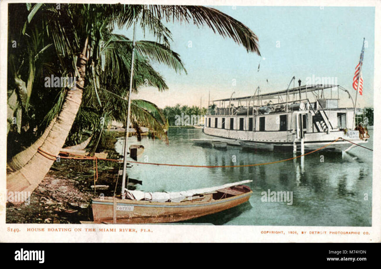 This image captures house boating on the Miami River in Florida ...