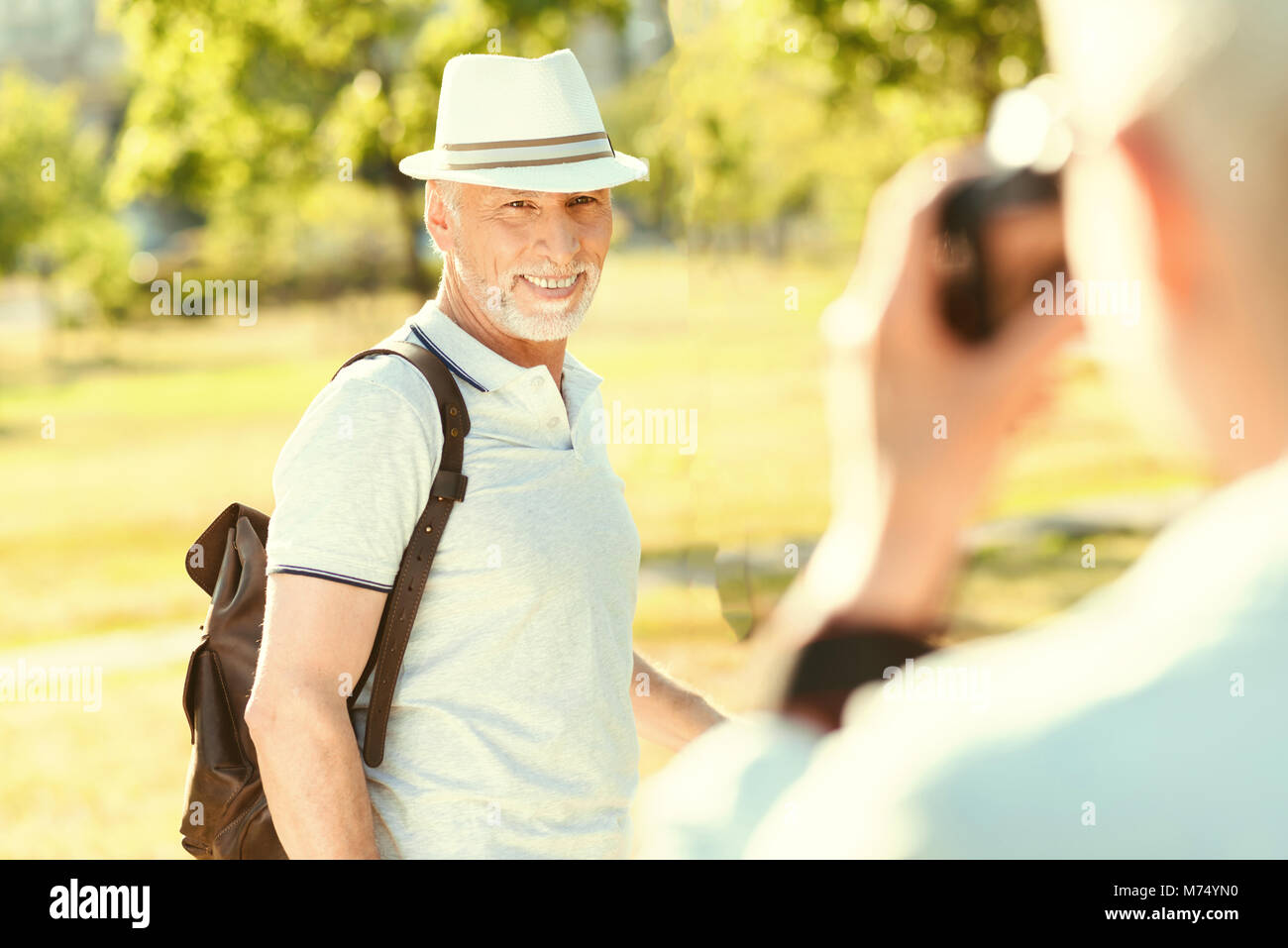 Cheerful delighted man posing for a photo Stock Photo - Alamy