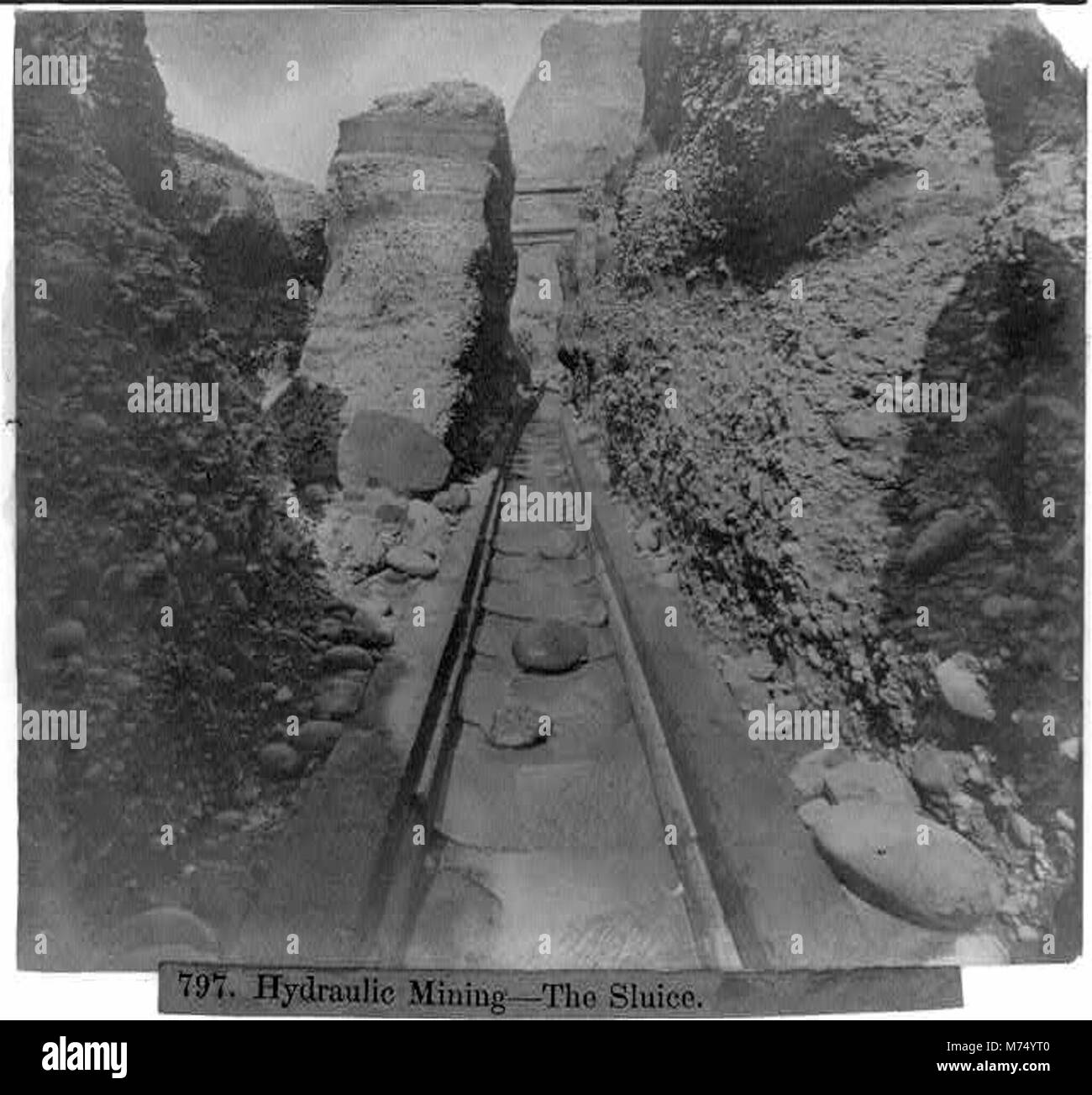 An image depicting hydraulic mining with a sluice, illustrating the ...