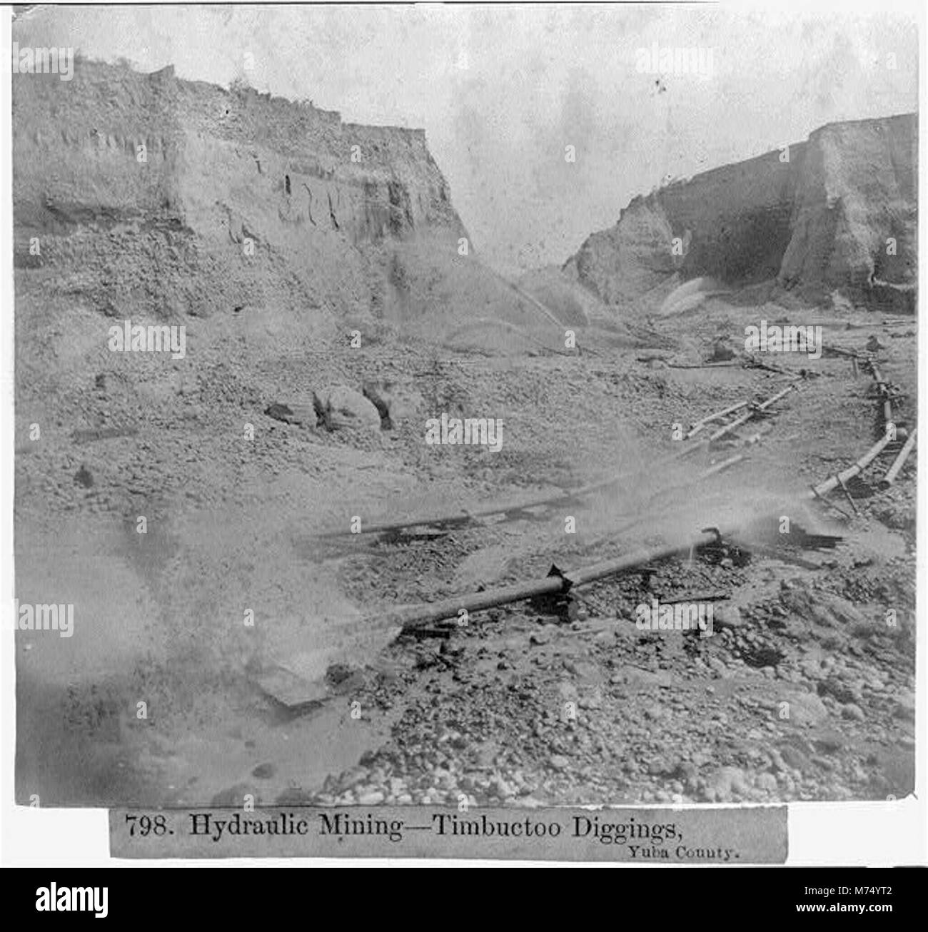 A historic photograph of hydraulic mining operations at the Timbuctoo ...