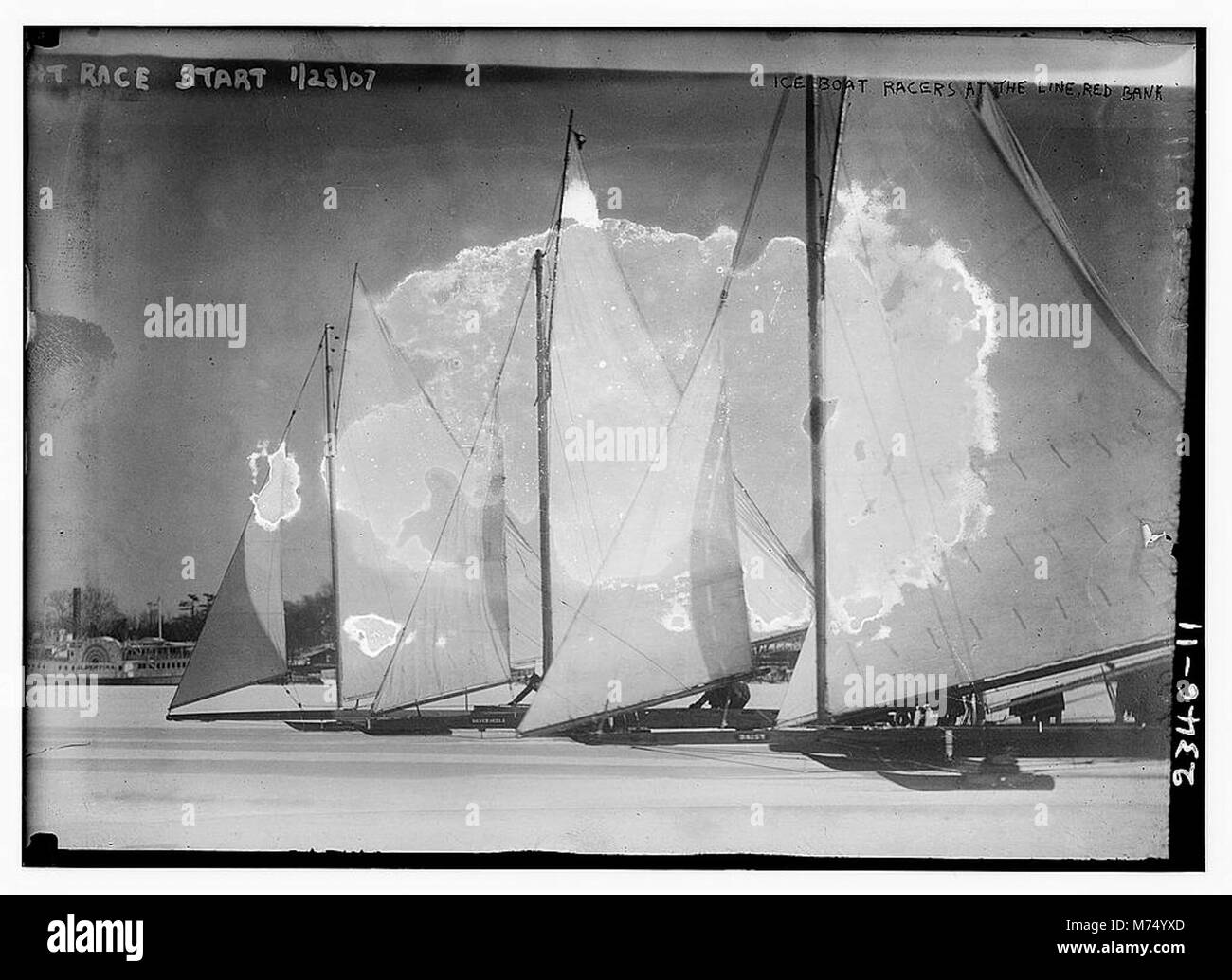 A historical photograph of ice boat racers lined up at the starting ...