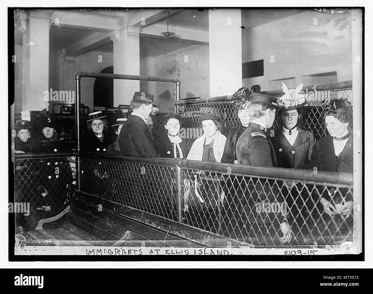 Immigrants are shown at Ellis Island, the primary entry point for ...