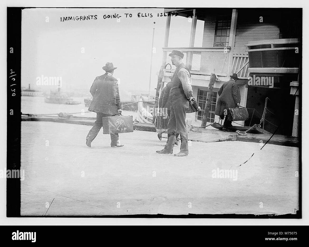 The image captures immigrants arriving at Ellis Island, marking a ...