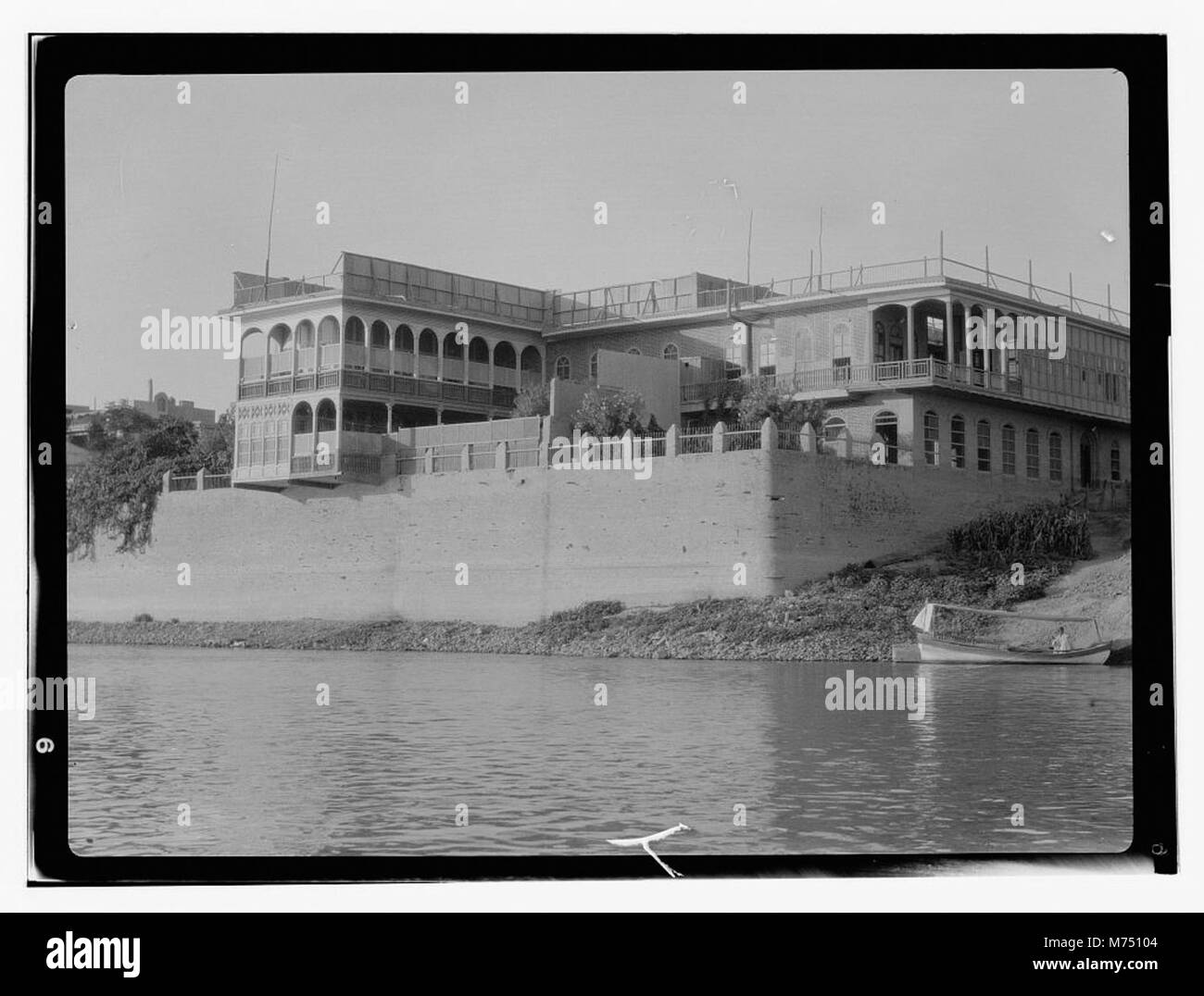 This image features a building located on the waterfront in Iraq ...