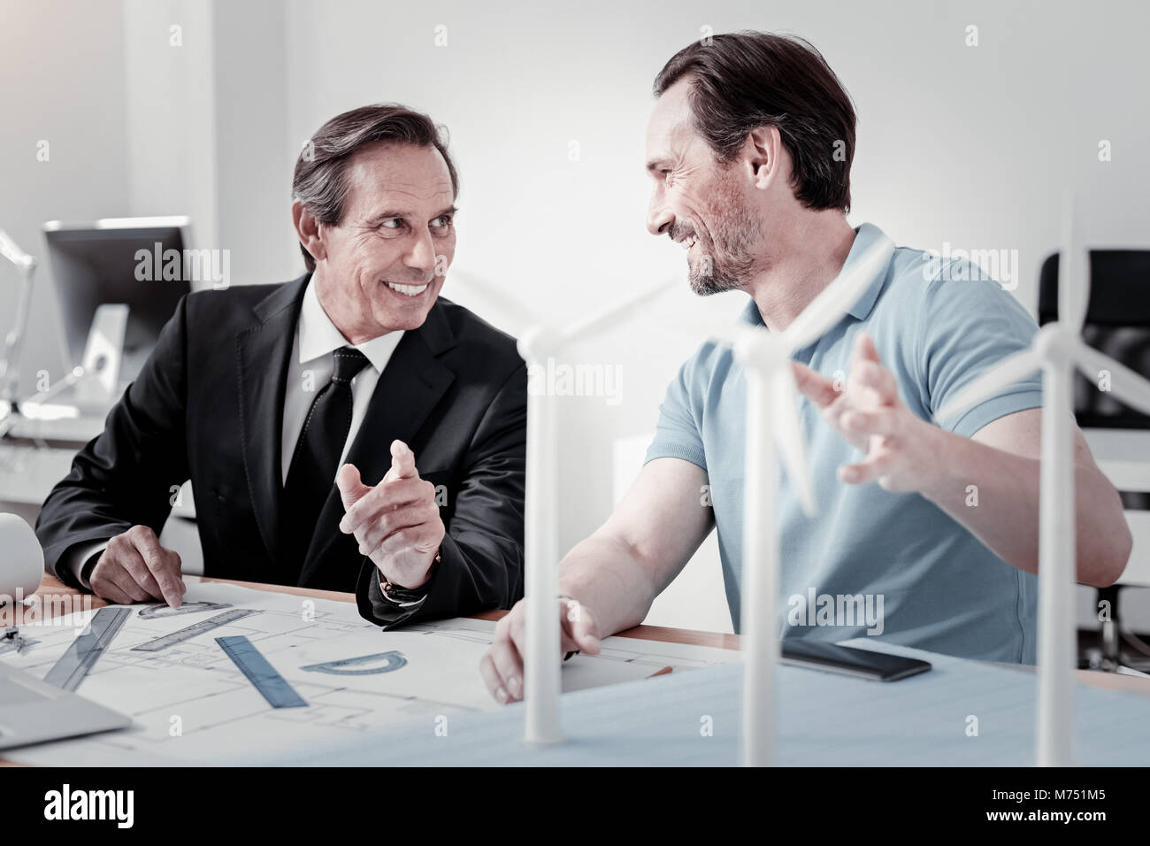 Friendly colleagues looking at each other Stock Photo - Alamy