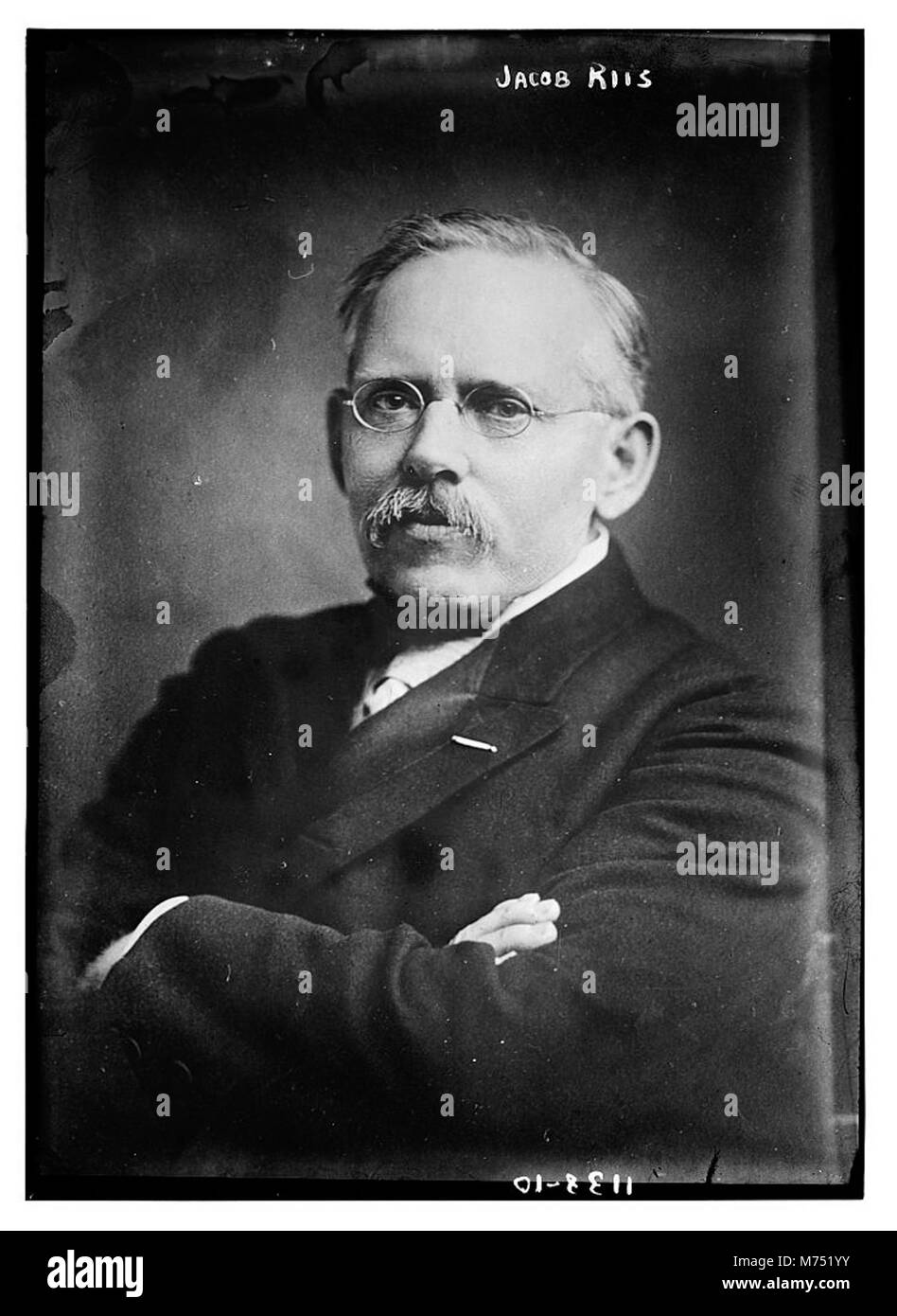 A portrait of Jacob Riis, a pioneering social reformer and ...