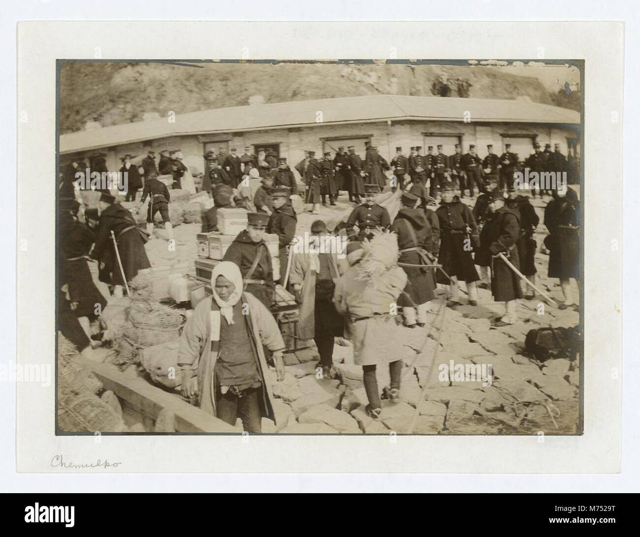 Japanese cavalry troops watching over their supplies on the beach at ...