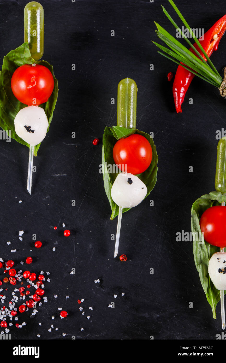 Canape caprese with olive oil Stock Photo - Alamy