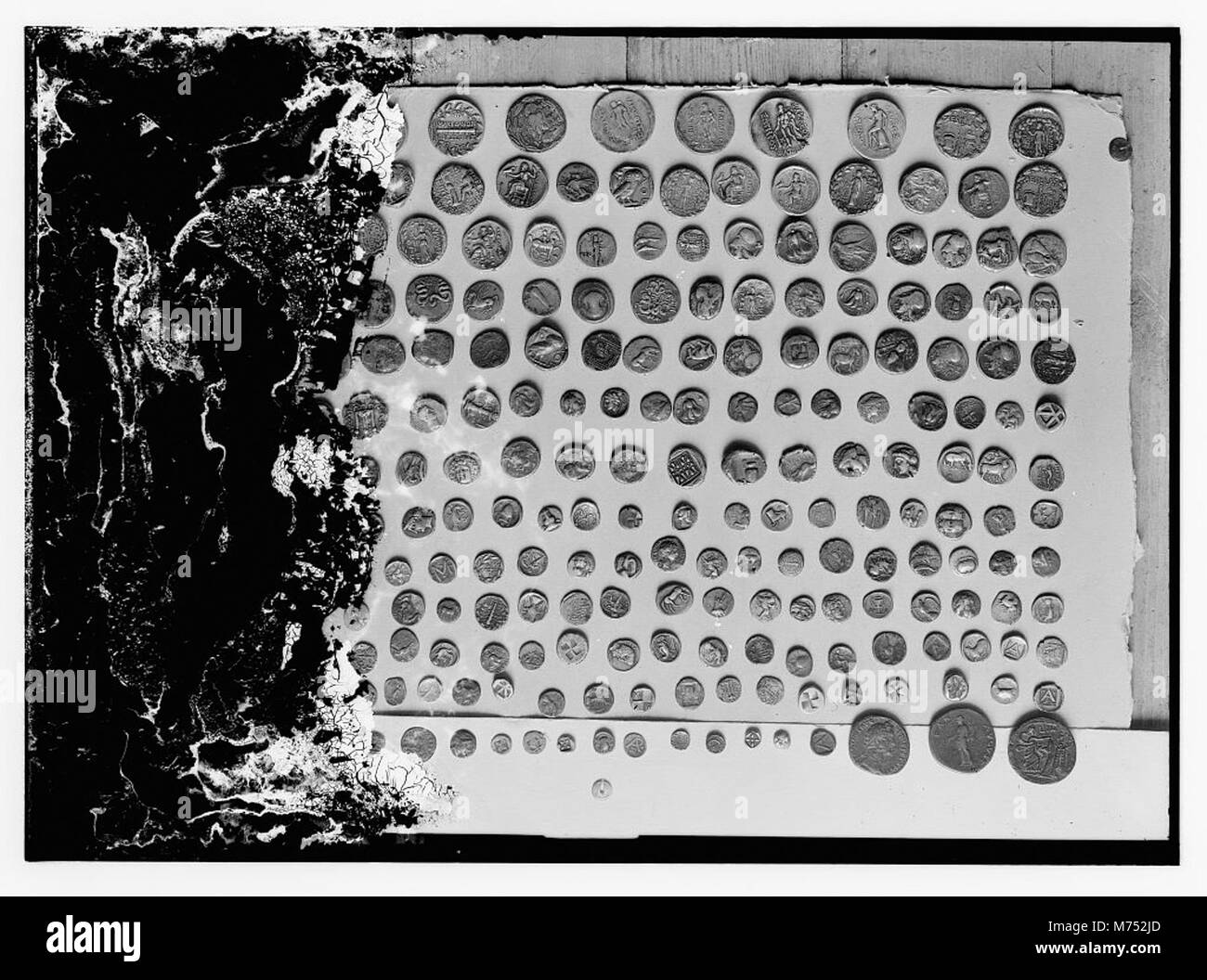 This image shows a collection of ancient coins, providing a glimpse ...