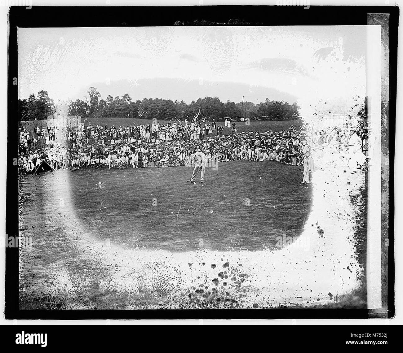 A photograph of Jim Barnes, a famous golfer, playing the last hole of a ...