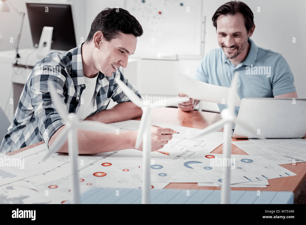 Attentive young architect working at scheme Stock Photo - Alamy