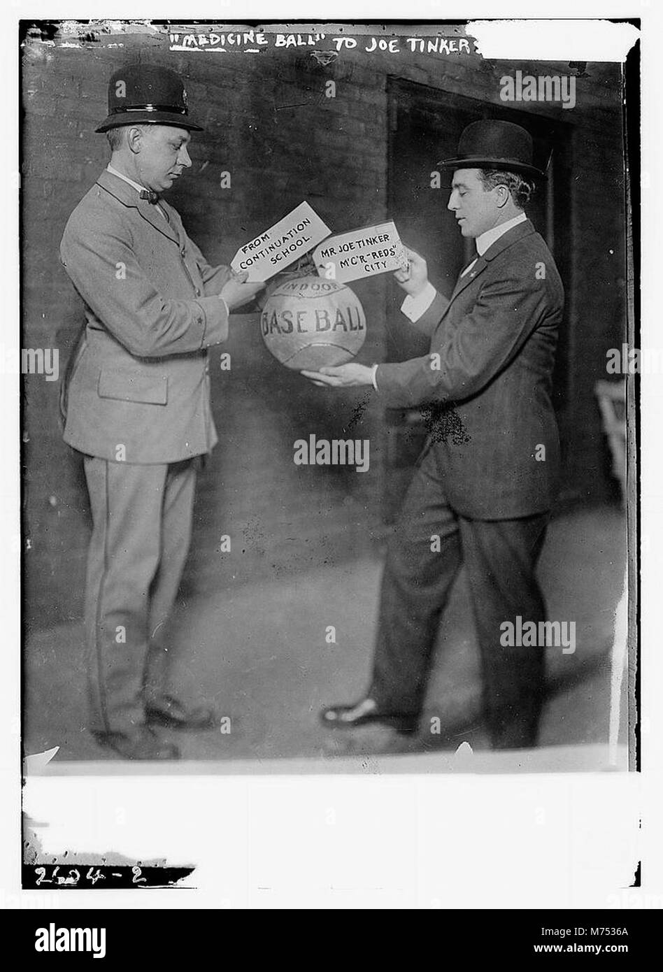 Joe Tinker, a notable baseball player, is seen receiving a medicine ...
