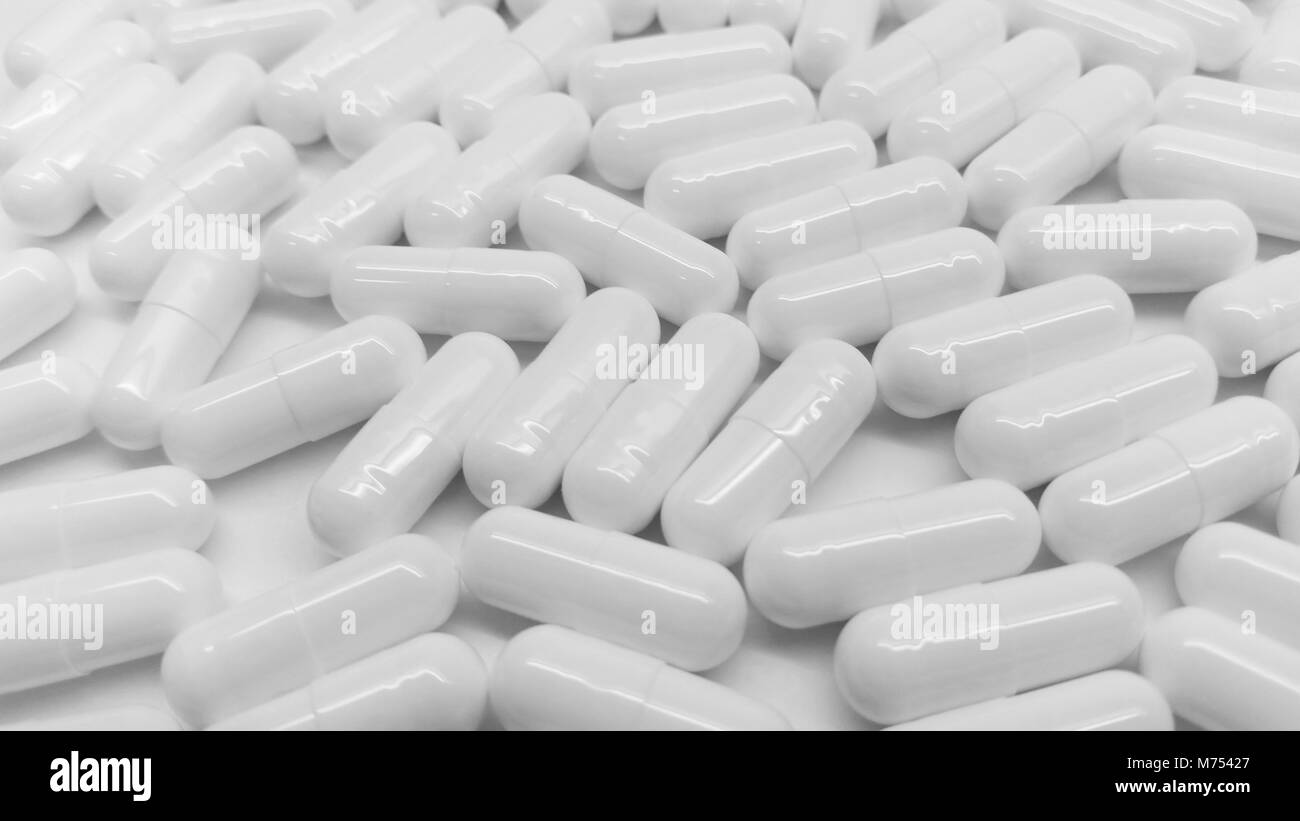 White capsules in the pharmacy laboratory Stock Photo - Alamy