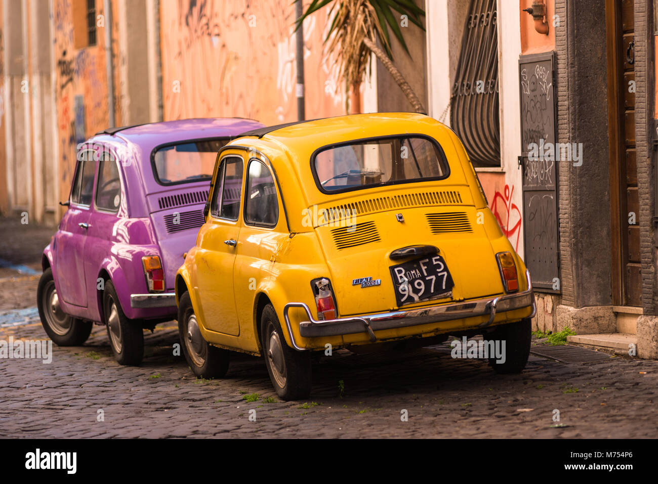 Two classic Fiat 500 cars parked on Trastevere backstreet, Rome, Lazio ...
