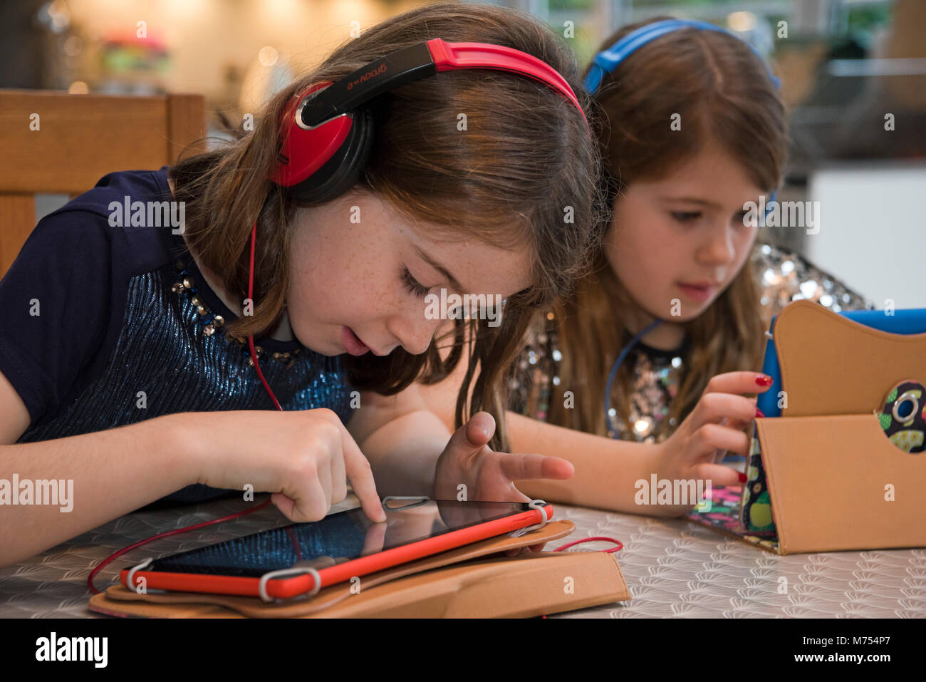 Horizontal portrait of two girls playing computer games together Stock ...