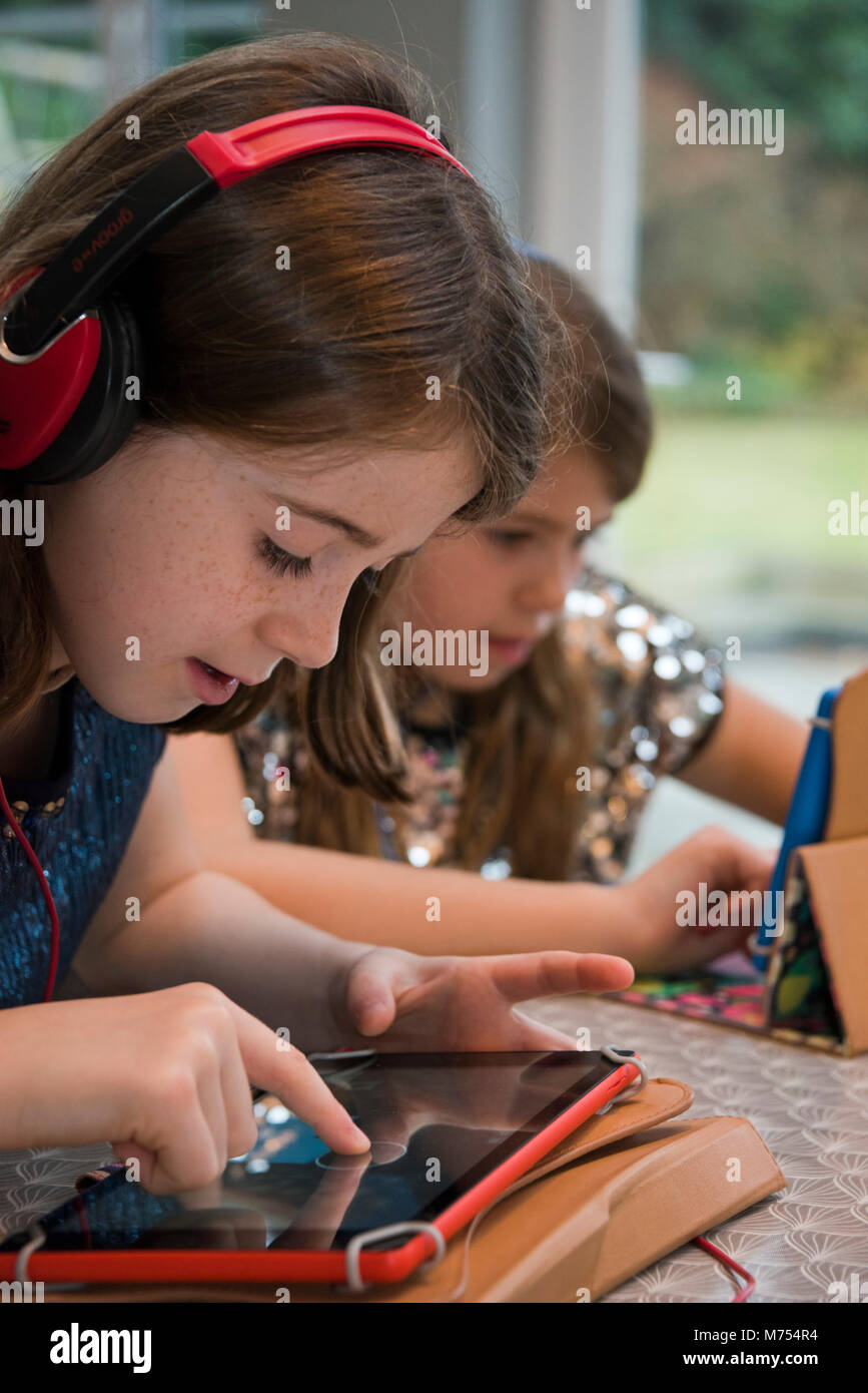 Vertical view of children playing on laptops together Stock Photo - Alamy