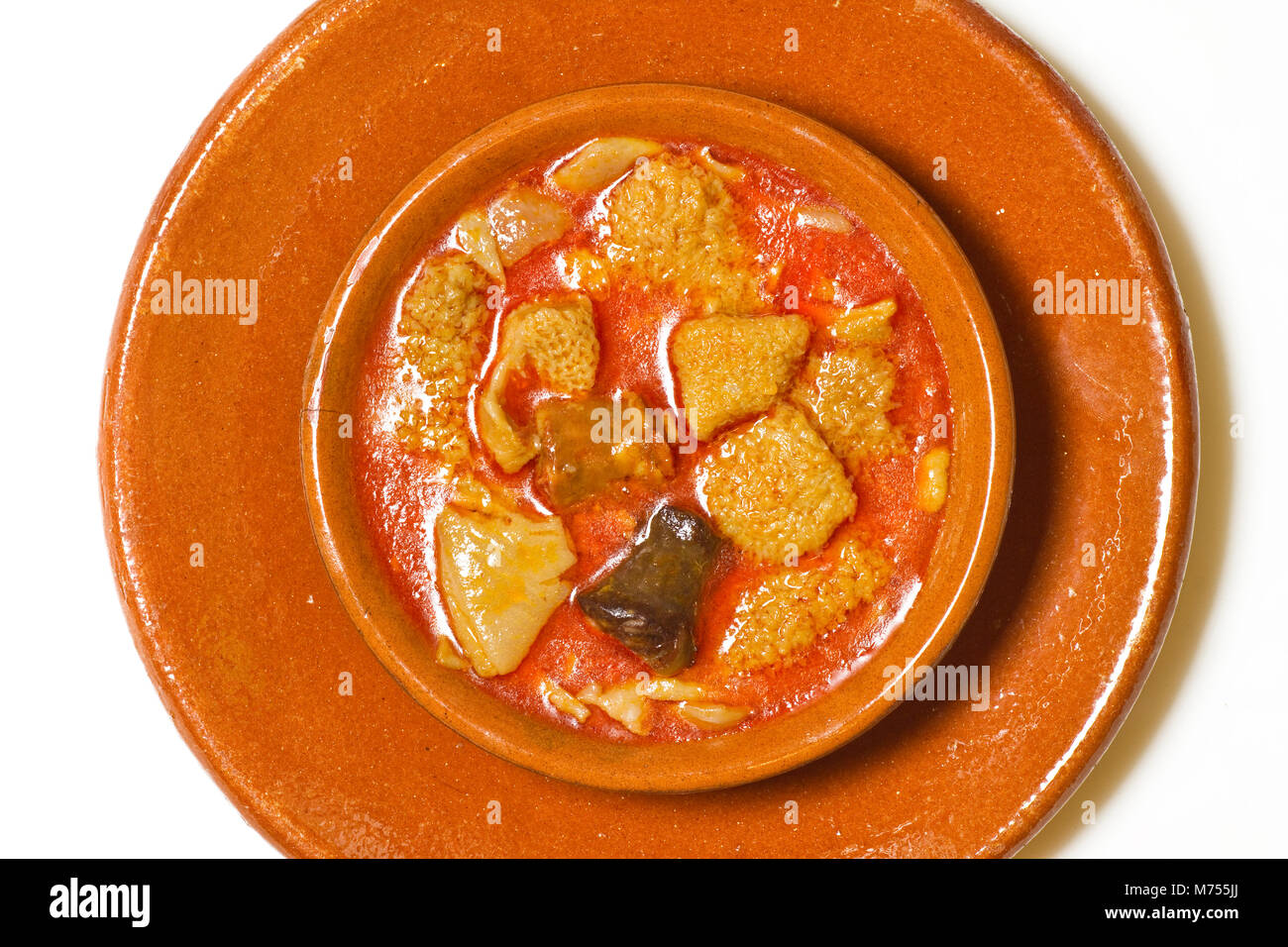 Spanish callos in an earthenware bowl and dish isolated on white Stock ...