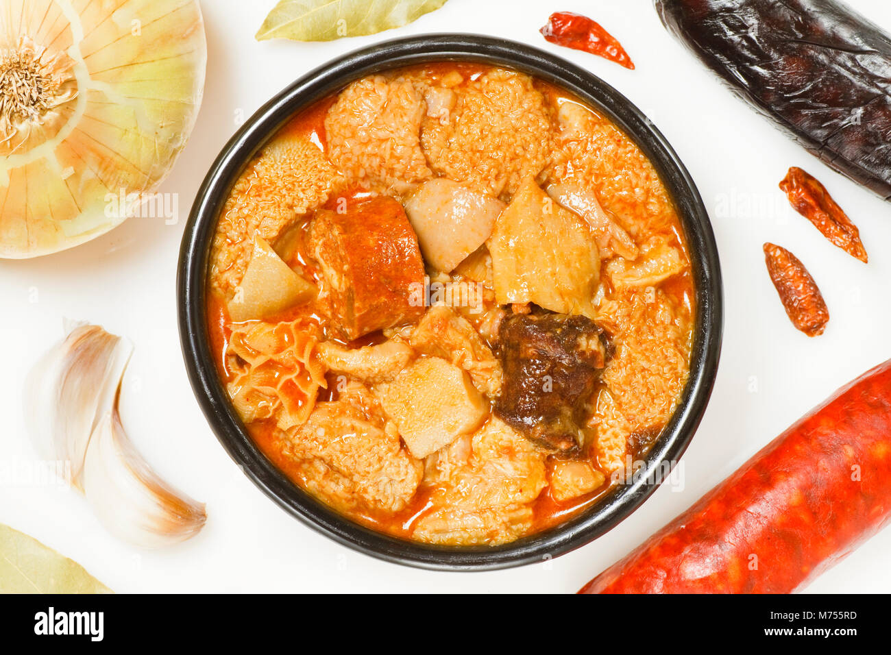 Spanish callos and ingredients on a white blackground Stock Photo - Alamy