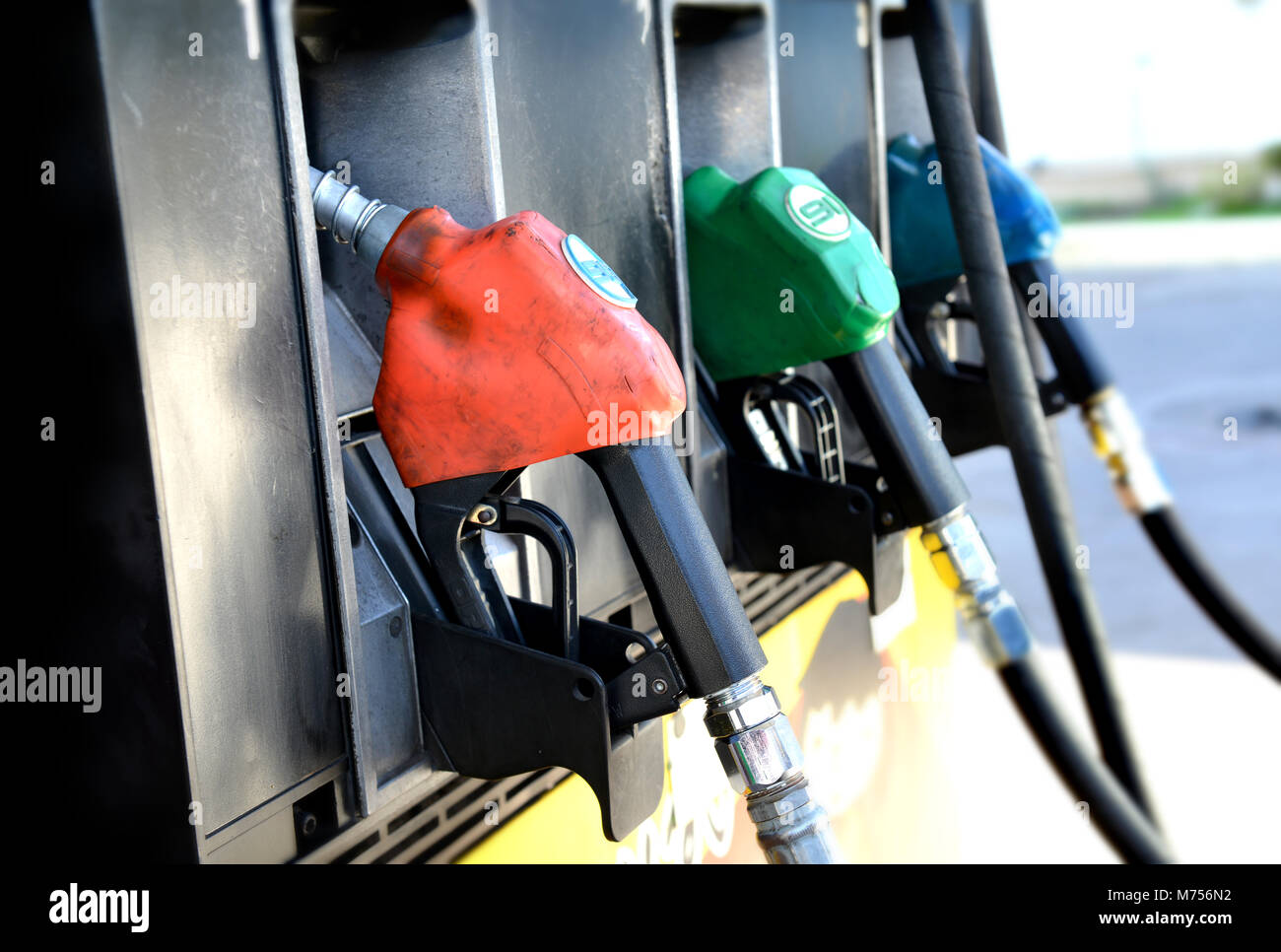 color of fuel nozzle gasoline pump fill time Stock Photo - Alamy