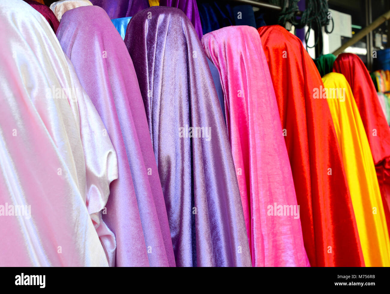 colorful fabric roll for sale at market Stock Photo - Alamy