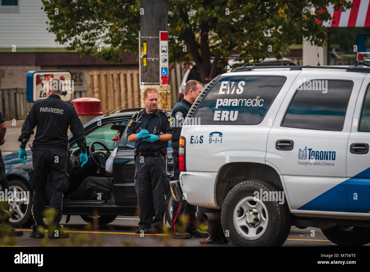 Paramedic rescue operation following a road accident Stock Photo - Alamy