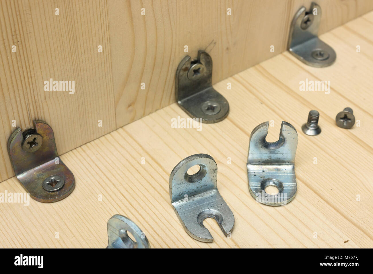 Metal fastening details at manufacturing wooden furniture Stock Photo ...