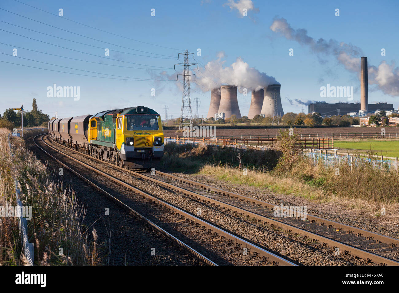 A Freightliner class 70 locomotive at Penketh Hall with an empty merry ...